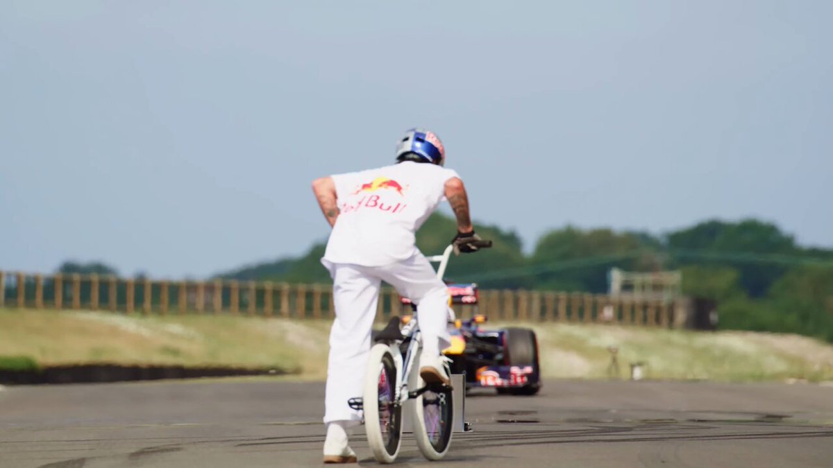 Pro BMX Rider Kriss Kyle Pulls Off Insane Jump Over Moving Red Bull F1 ...